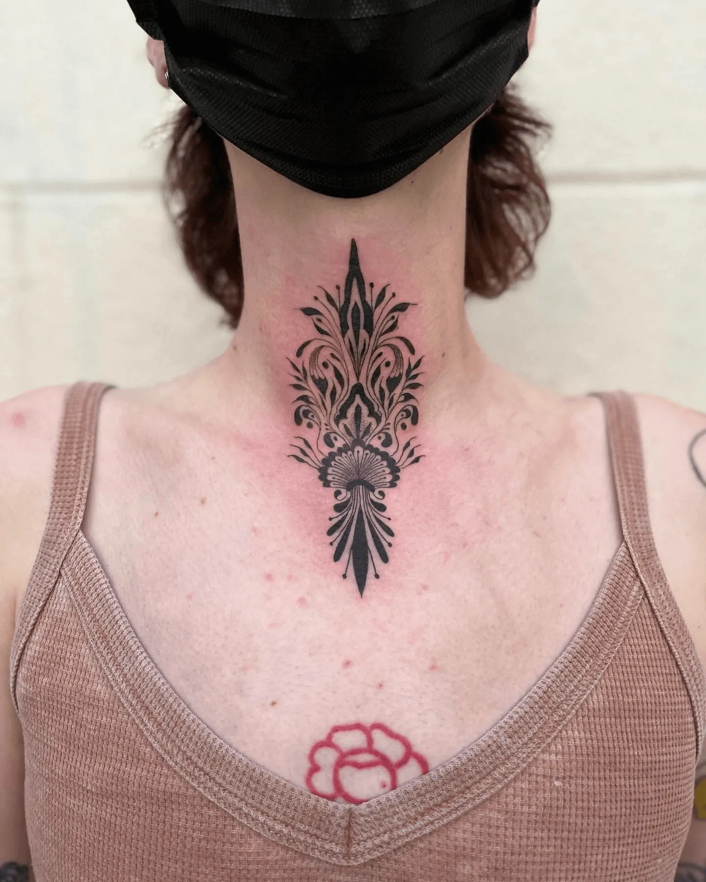 15 Throat Tattoos For Women That Make A Bold Statement